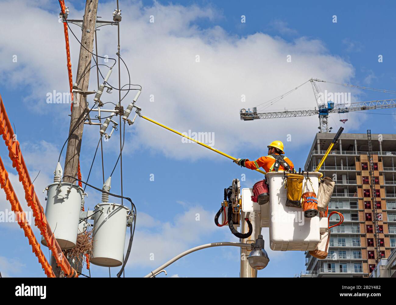 Worker climbing utility pole hi-res stock photography and images - Alamy