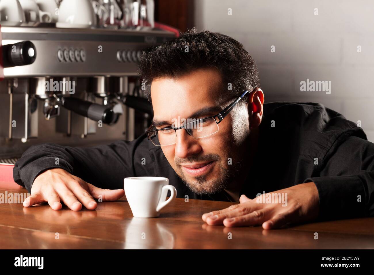 Sommelier Examining Coffee Cream In Espresso Cup Stock Photo - Alamy
