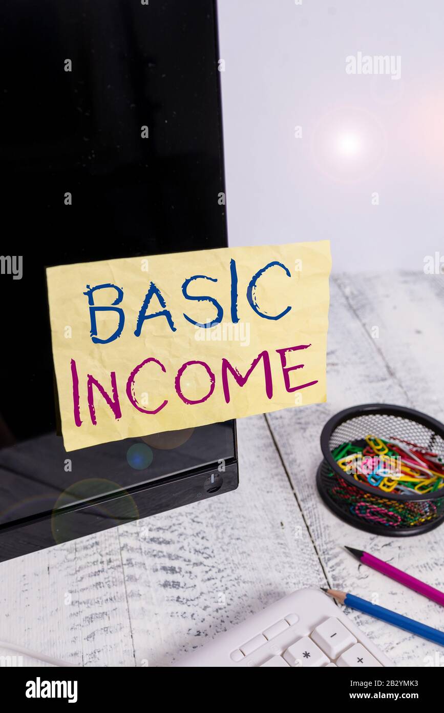 Text sign showing Basic Income. Business photo showcasing periodic cash ...