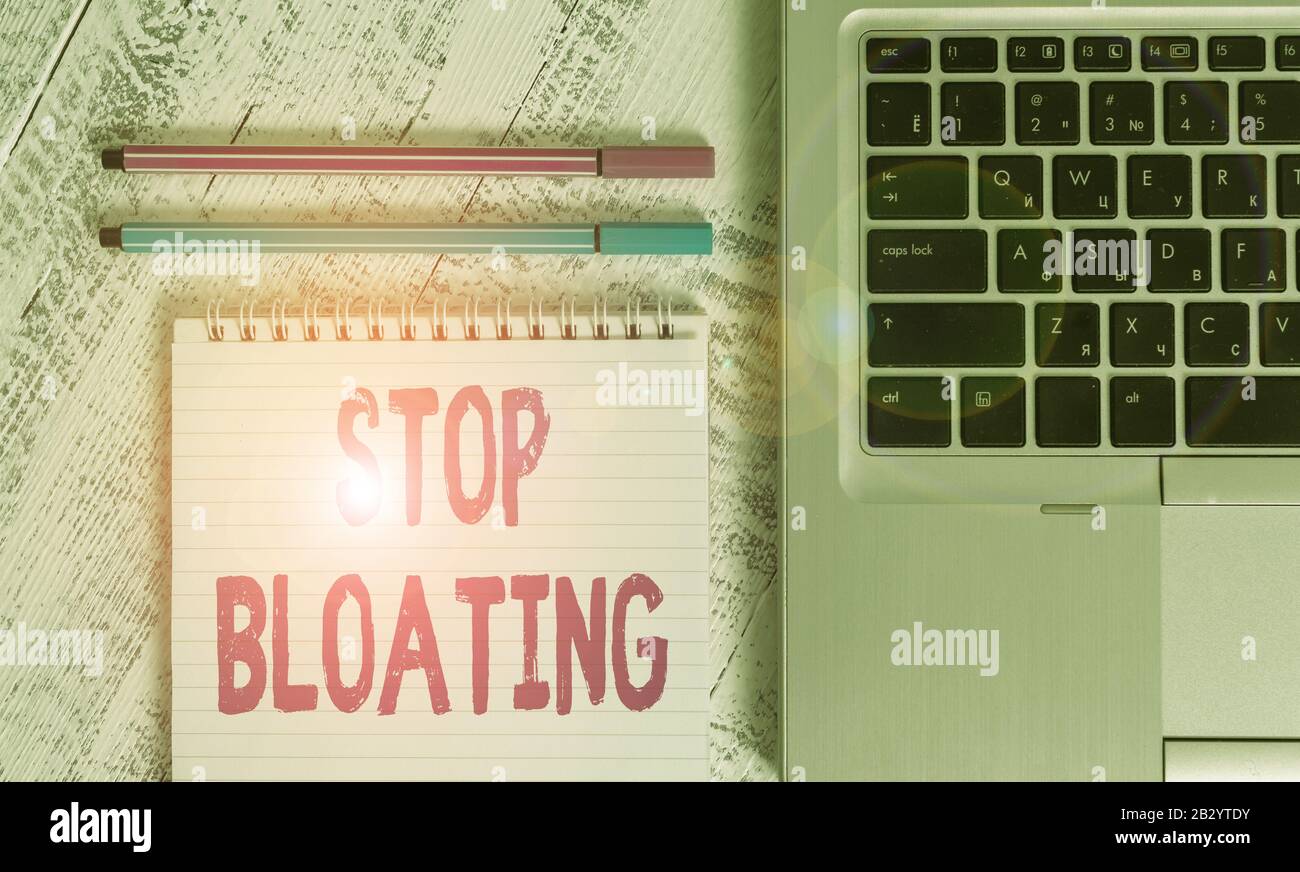Writing note showing Stop Bloating. Business concept for to end the ...