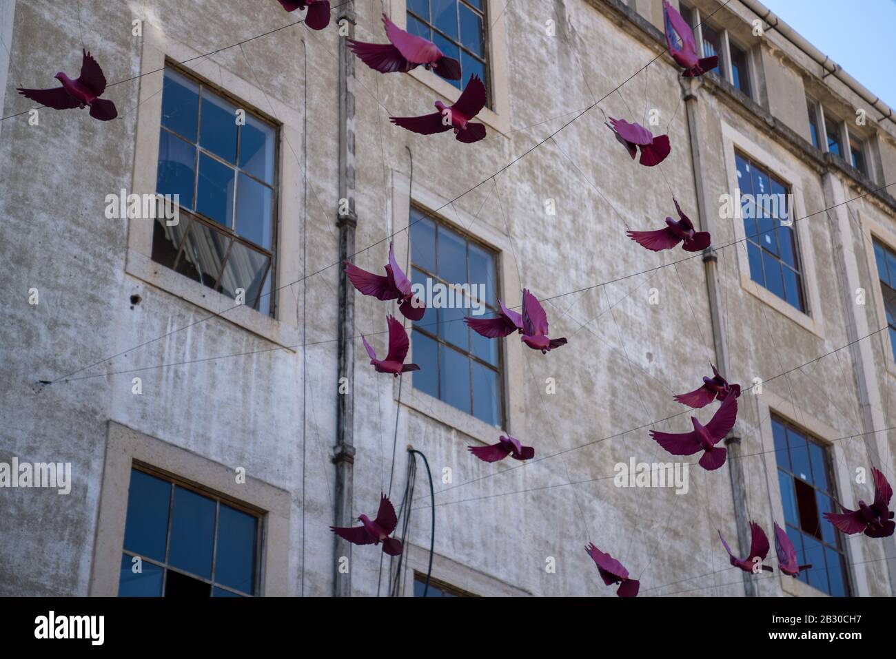 Decorative paper birds strung up in decorative commercial setting Stock ...