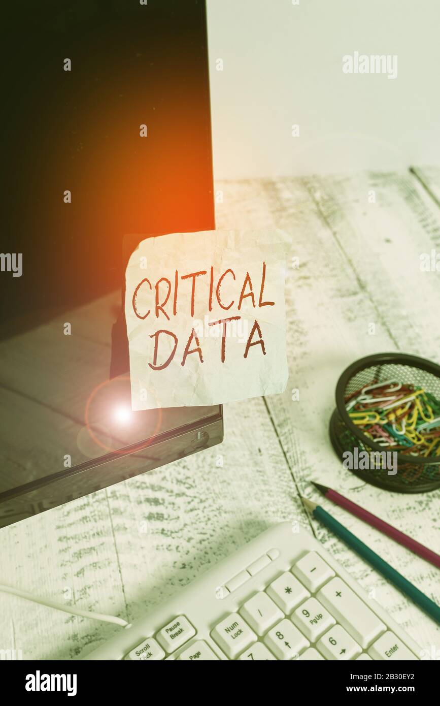 Writing note showing Critical Data. Business concept for elements of ...