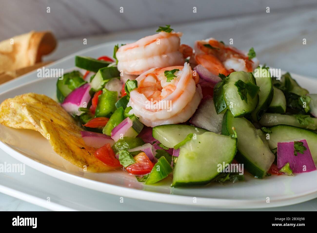 Chilled spicy Peruvian ceviche with shrimp and plantain banana chips ...
