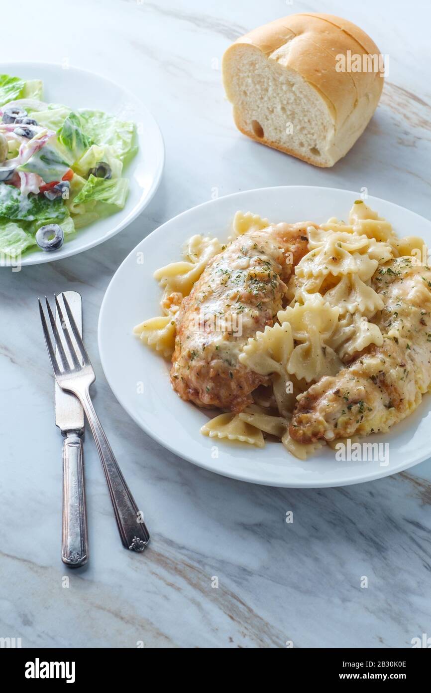Italian American Chicken francese with farfalle pasta side salad and ...