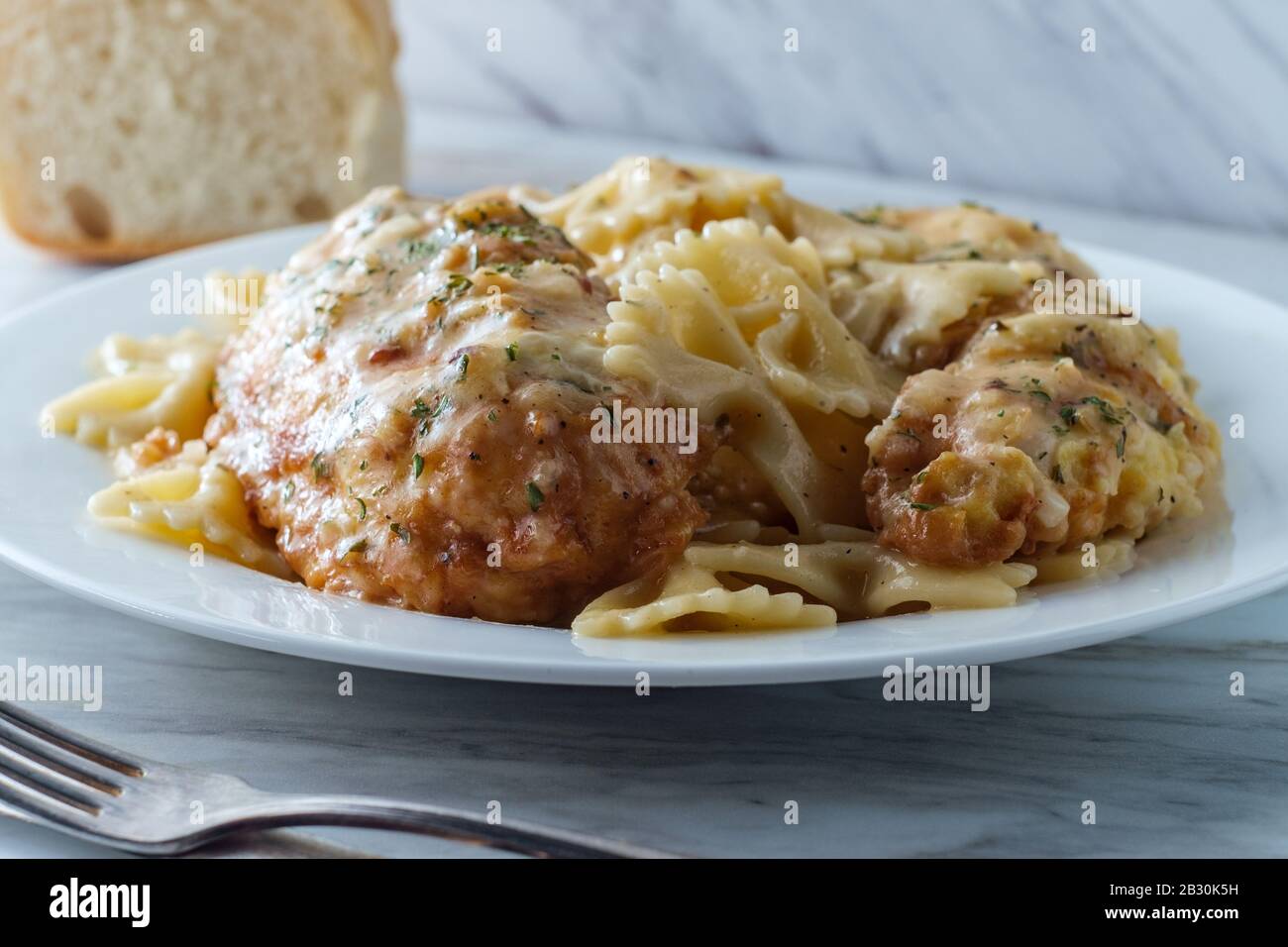 Italian American Chicken francese with farfalle pasta side salad and ...