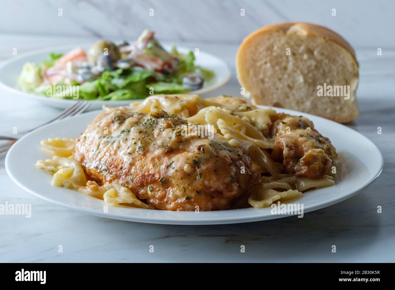 Italian American Chicken francese with farfalle pasta side salad and ...