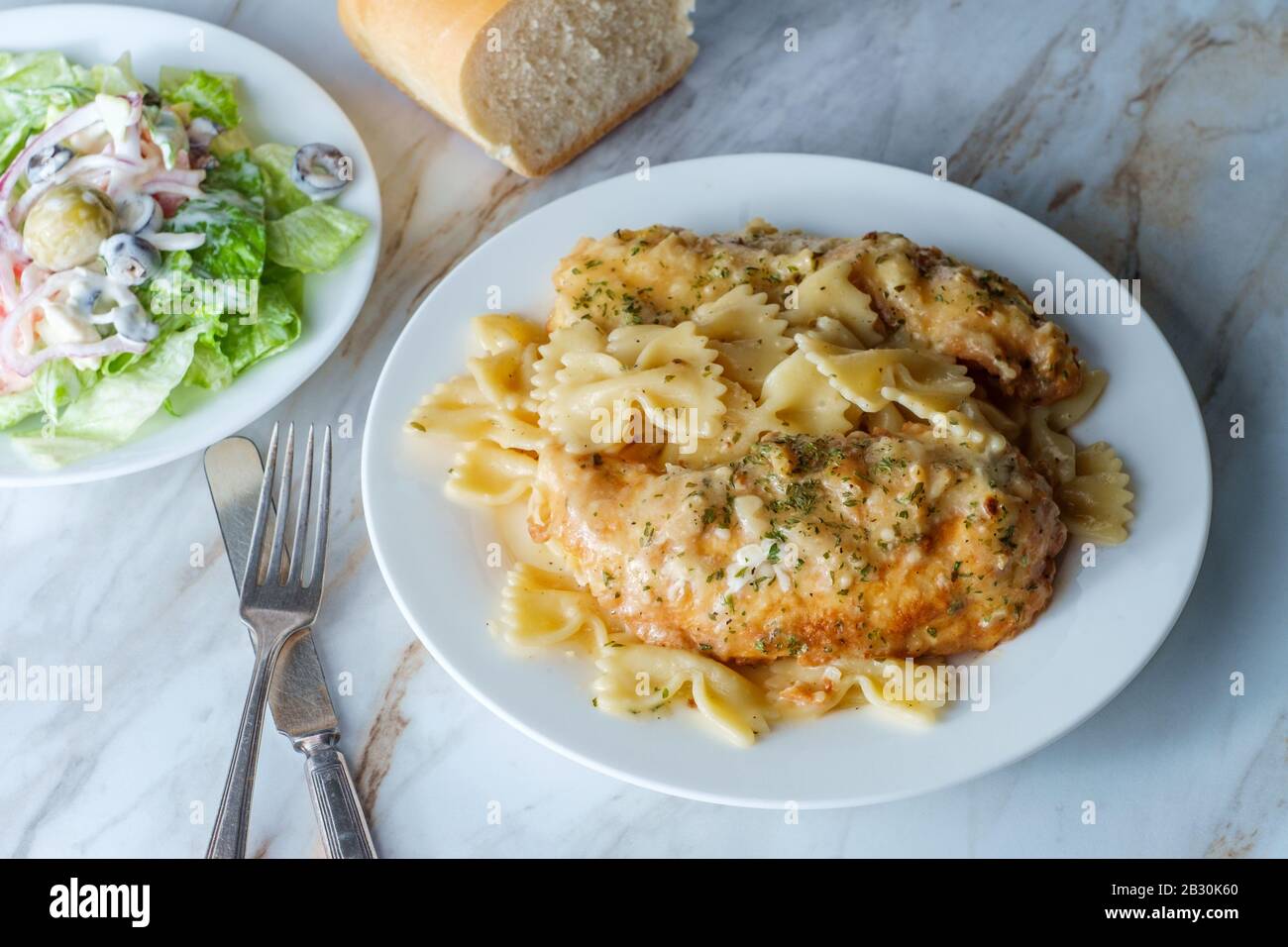 Italian American Chicken francese with farfalle pasta side salad and ...