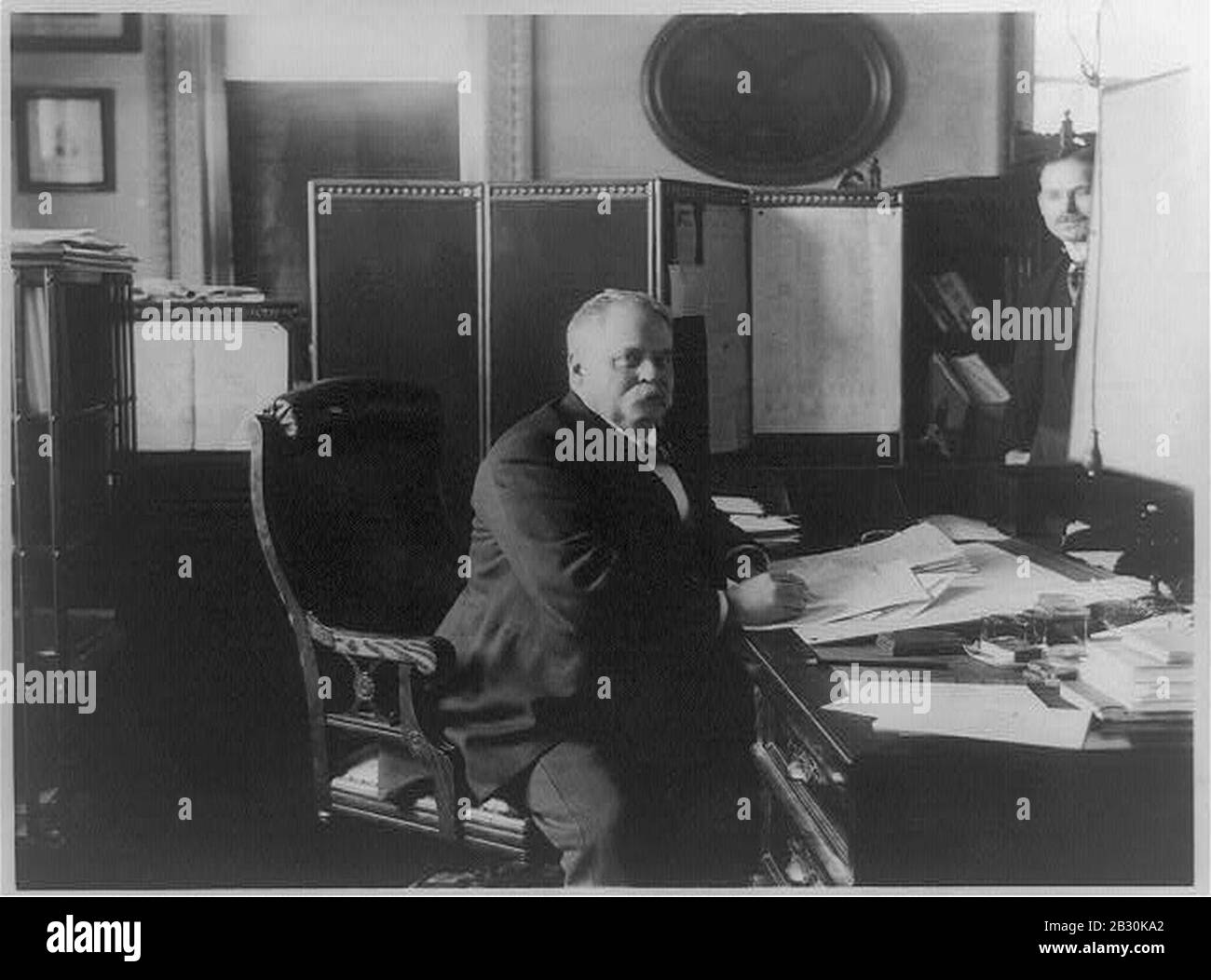 General Fitzhugh Lee three-quarter length portrait seated at desk ...