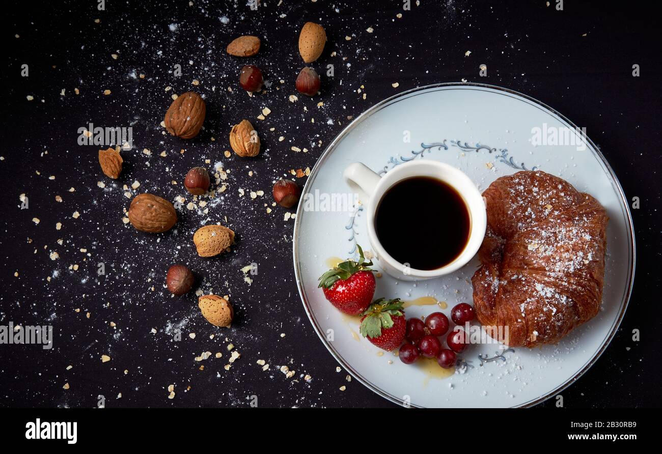 Top shot of croissant with some fruit and nuts Stock Photo - Alamy