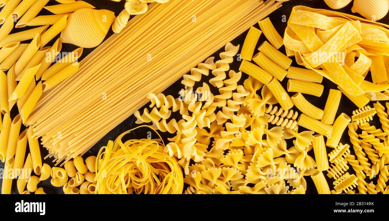 Italian pasta panoramic banner, a flatlay of many different pasta types ...