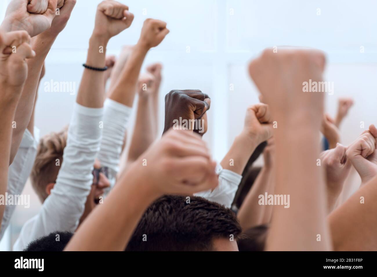 cropped image of a group of young people holding their hands up Stock ...