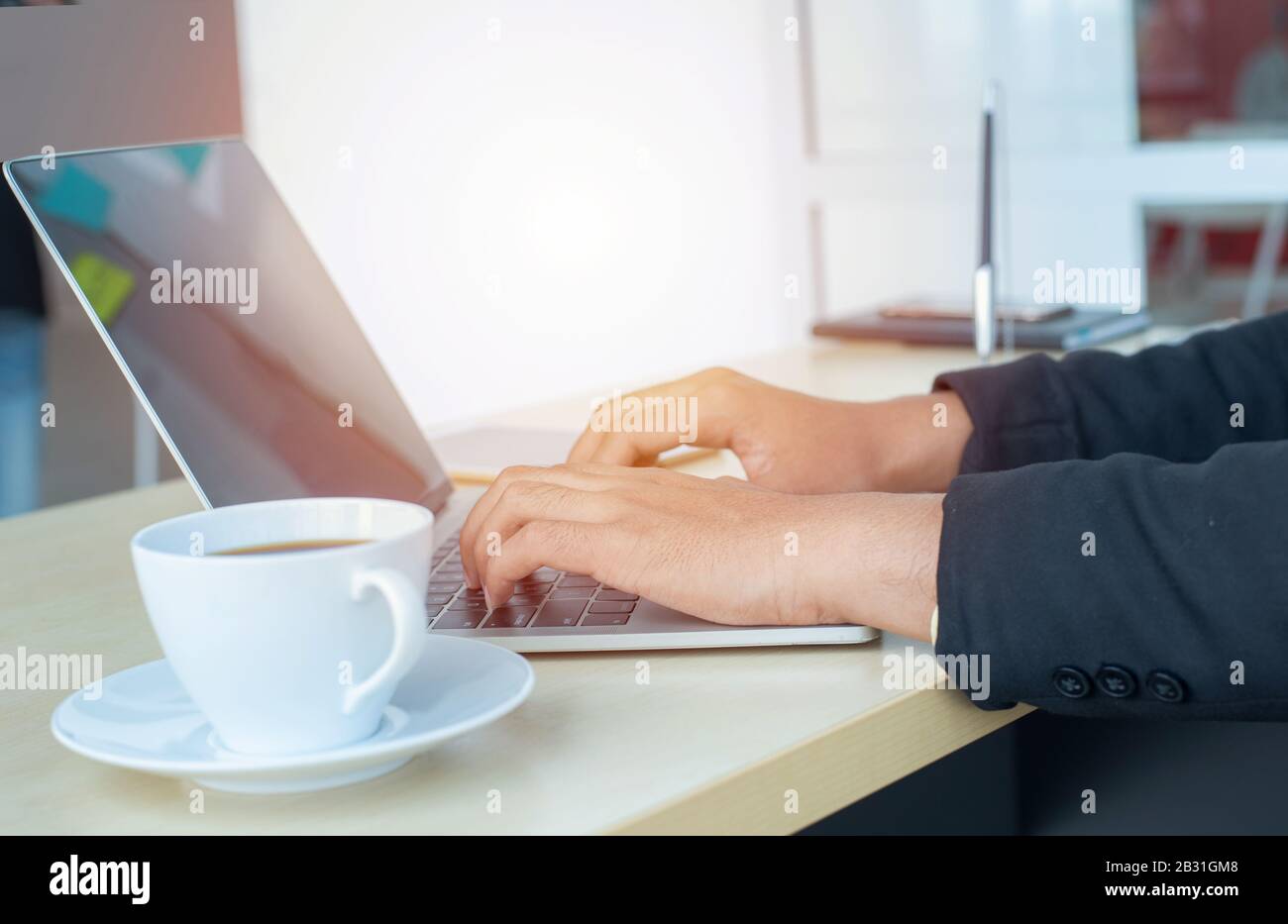 Asian business man hands typing on laptop computer keyboard with ...
