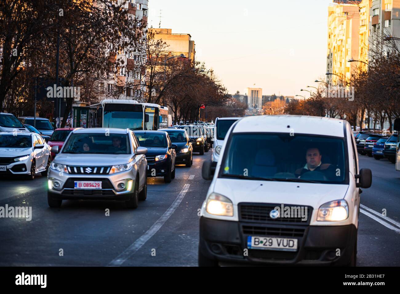 Car traffic at rush hour in downtown area of the city. Car pollution ...