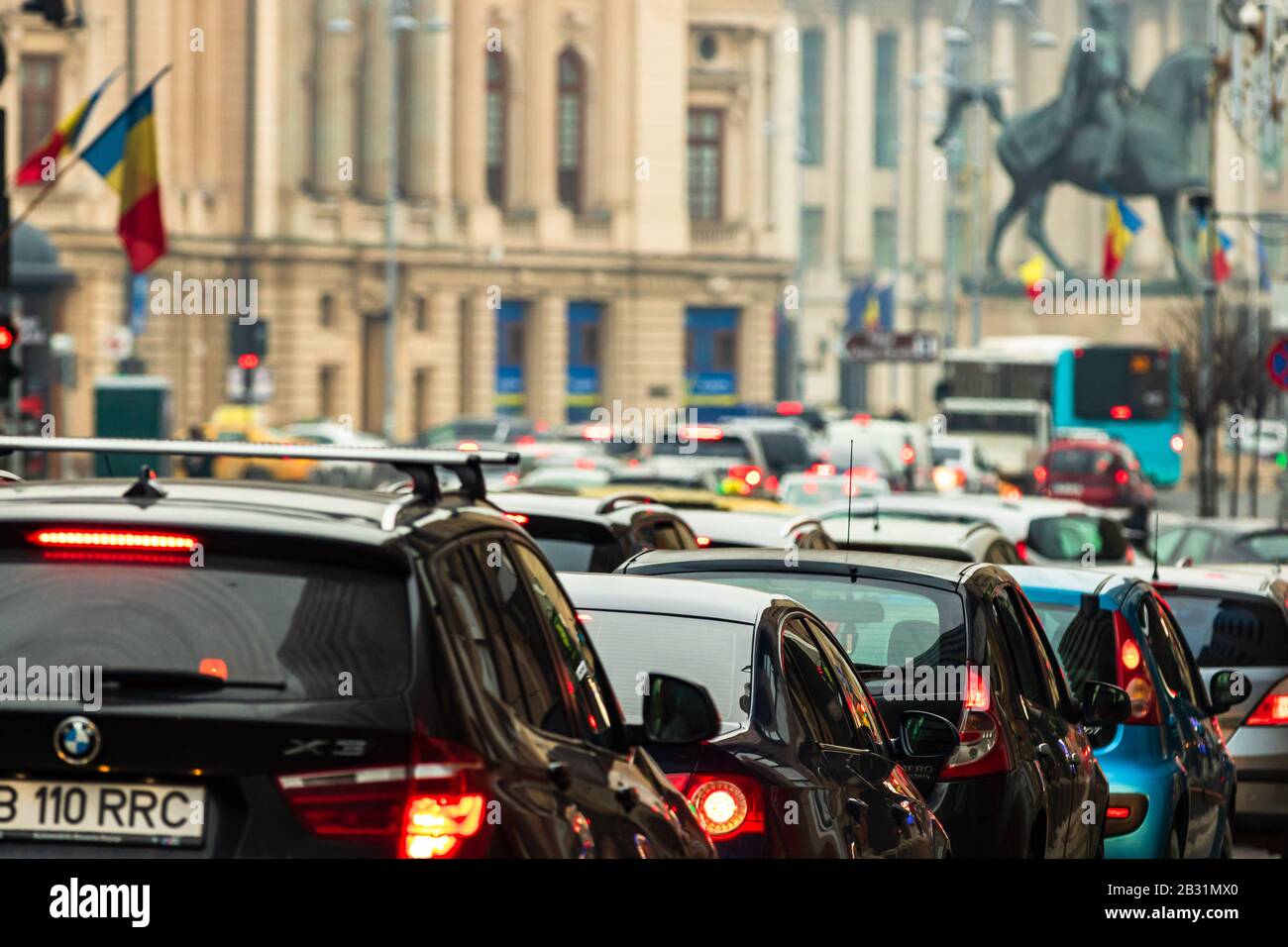 Car traffic at rush hour in downtown area of the city. Car pollution ...