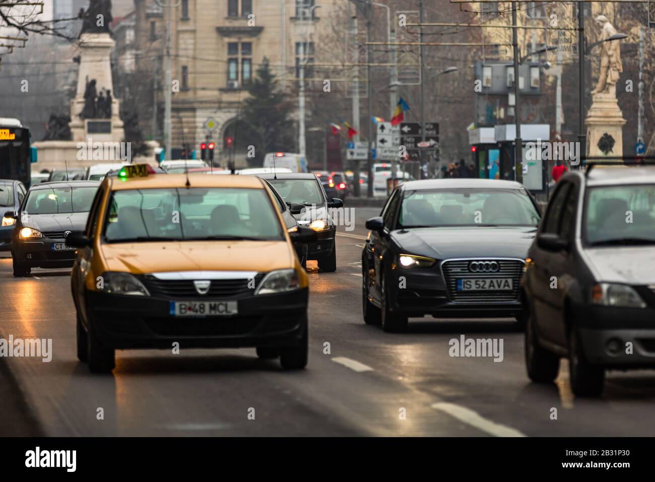 Car traffic at rush hour in downtown area of the city. Car pollution ...