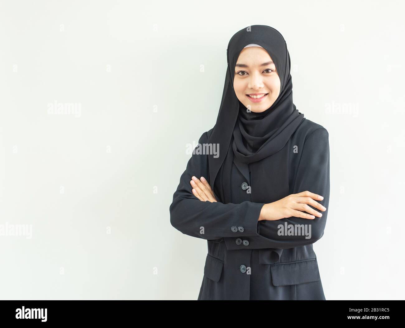 Beautiful female Muslim model in modern kurung and hijab, a modern ...
