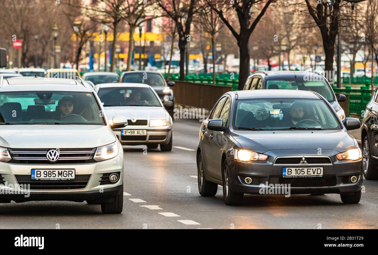 Car traffic at rush hour in downtown area of the city. Car pollution ...