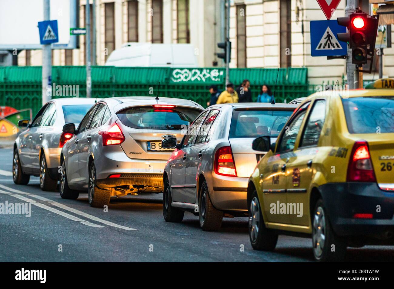 Car traffic at rush hour in downtown area of the city. Car pollution ...