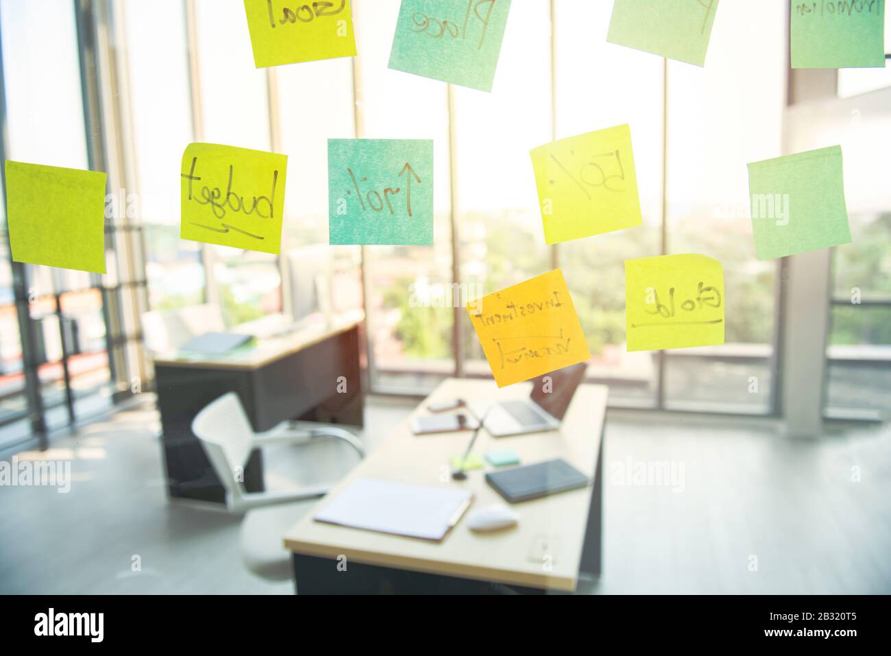 post it stick on glass window of nobody in modern smart office ...