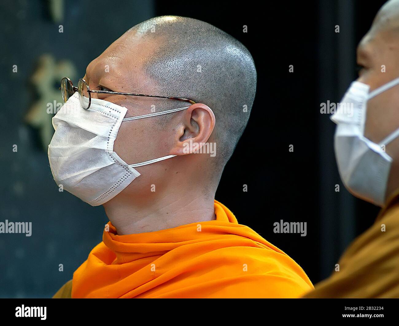 Monks wearing masks hi-res stock photography and images - Alamy