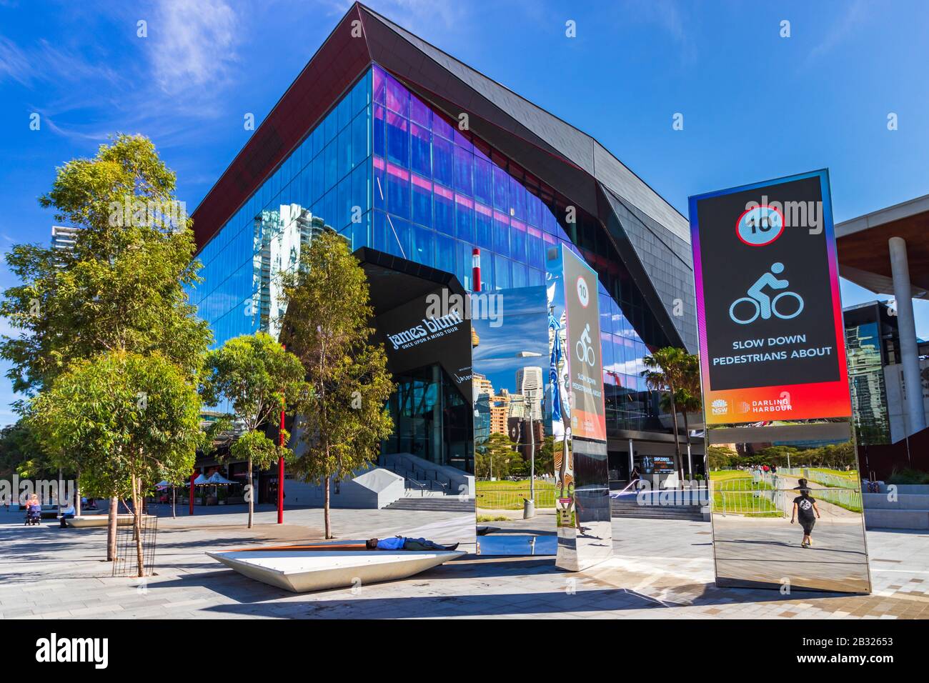 Pedestrian area at the Darling Harbour and a slow down bikes sign in ...