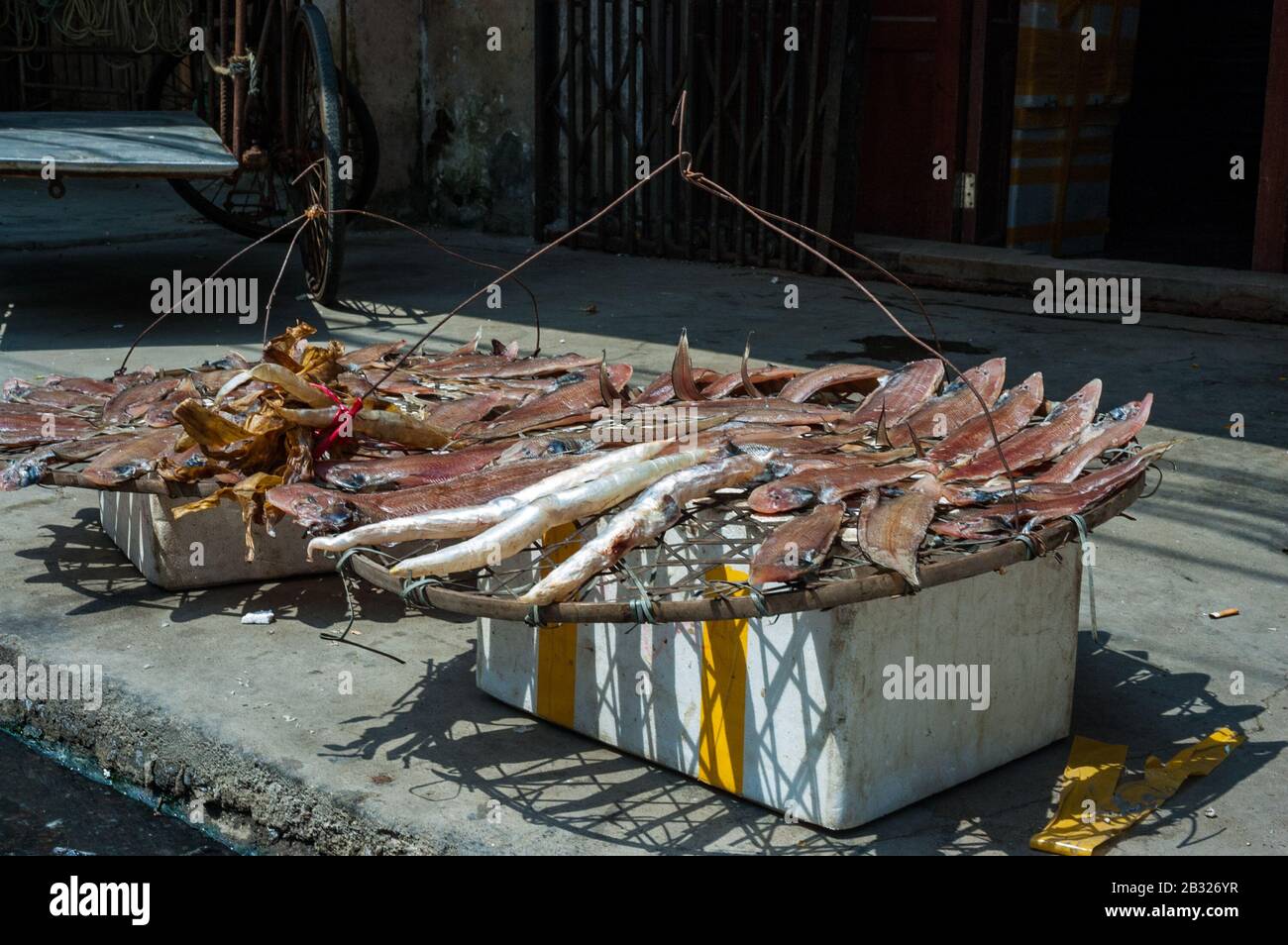 Fish drying in the street in Beihai’s old quarter, Guangxi Province ...