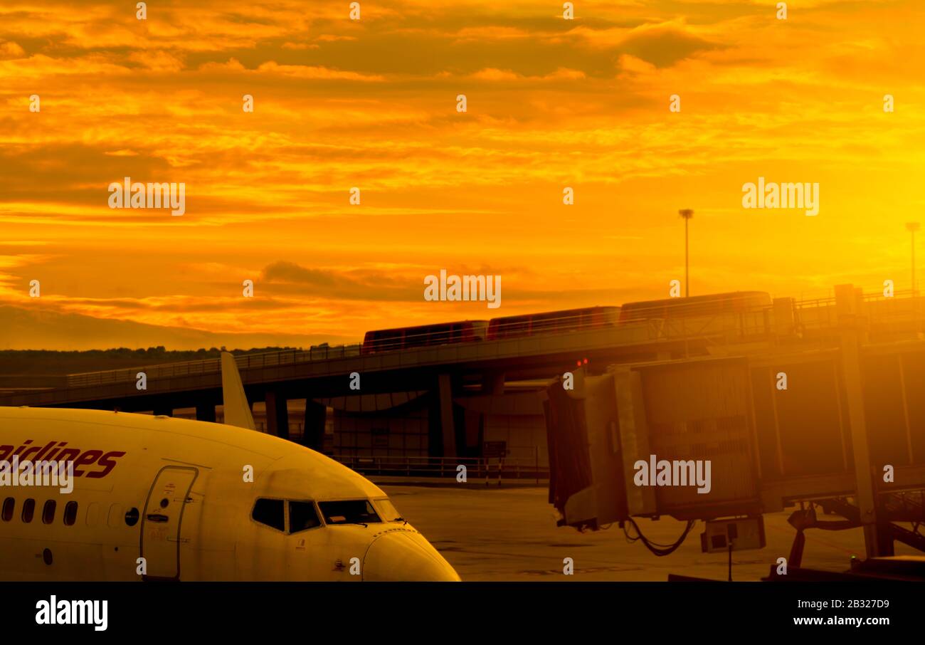 Commercial airplane parked at jet bridge for passenger take off at the ...