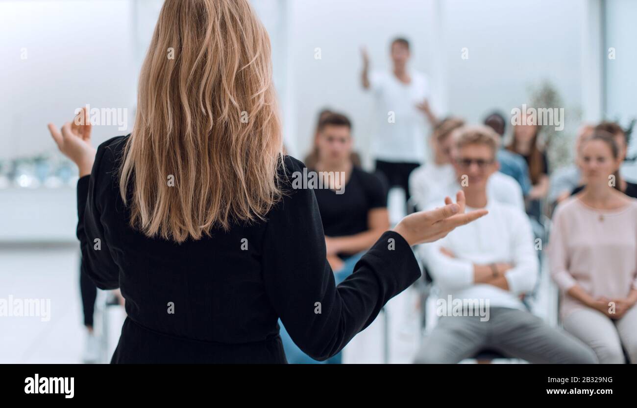 background image of a business seminar in a bright conference room ...