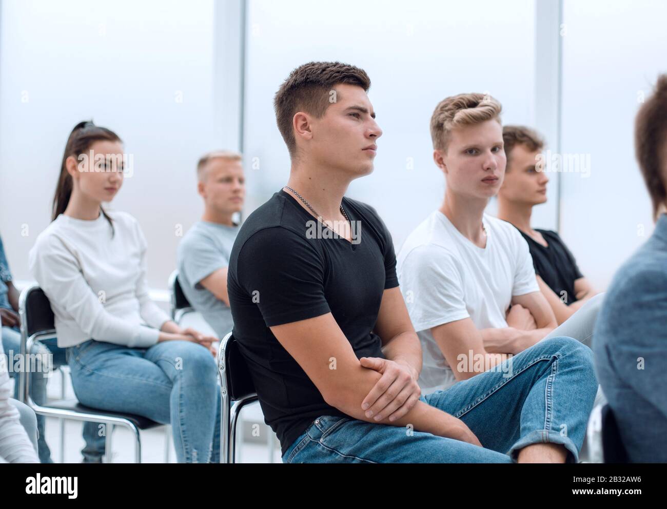 group of diverse young men looking at the camera Stock Photo - Alamy