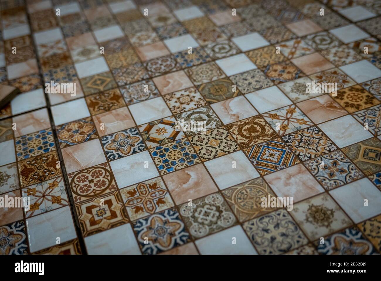 Small tiles of ceramic mosaic on the wall Stock Photo - Alamy