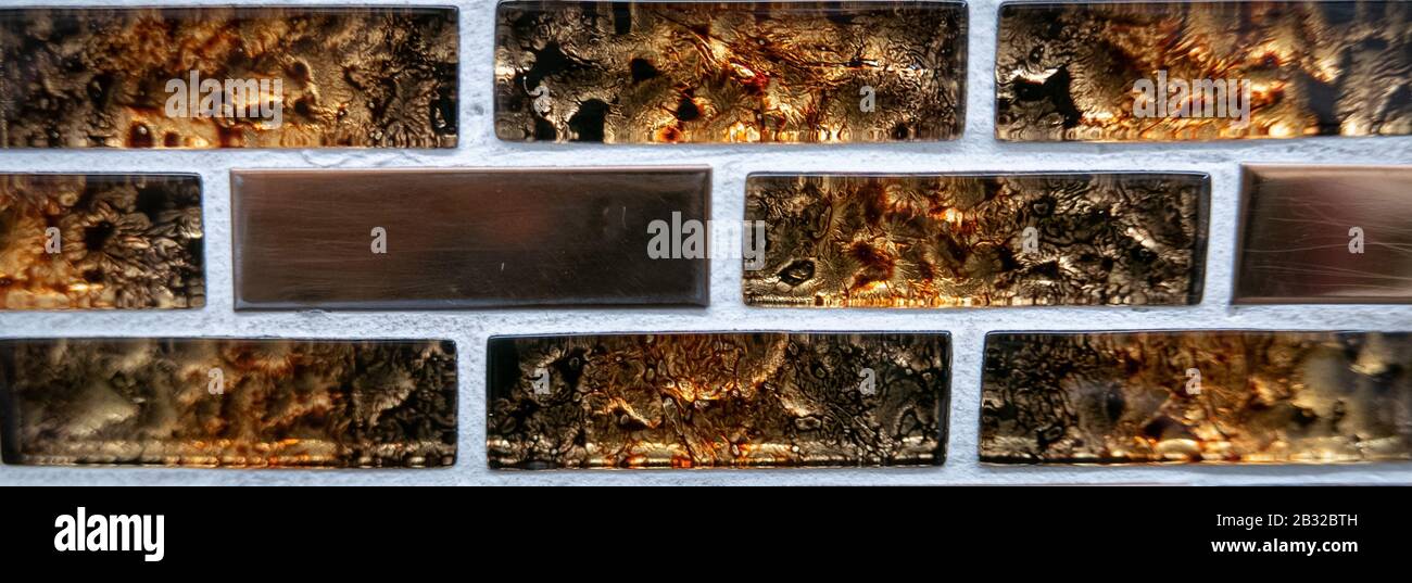 Decorative rust or orange glass bricks on the wall as background Stock ...