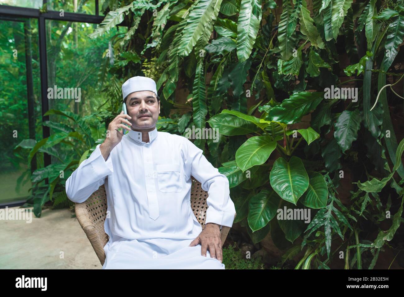 Middle eastern Emirati man in traditional clothing called kandura ...