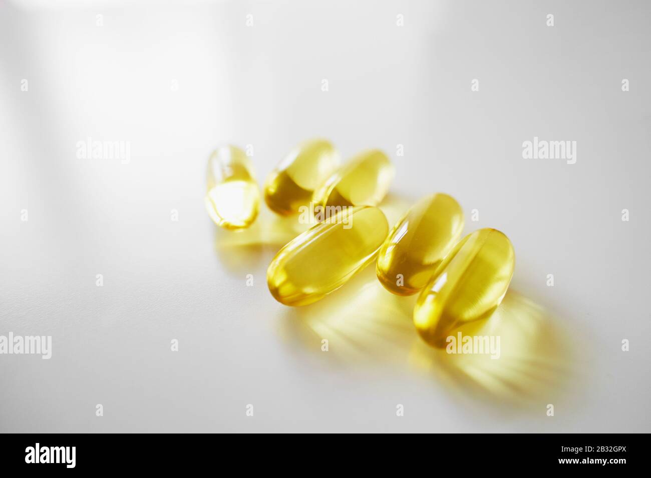 Organic omega 3 pills in flower shape Stock Photo - Alamy