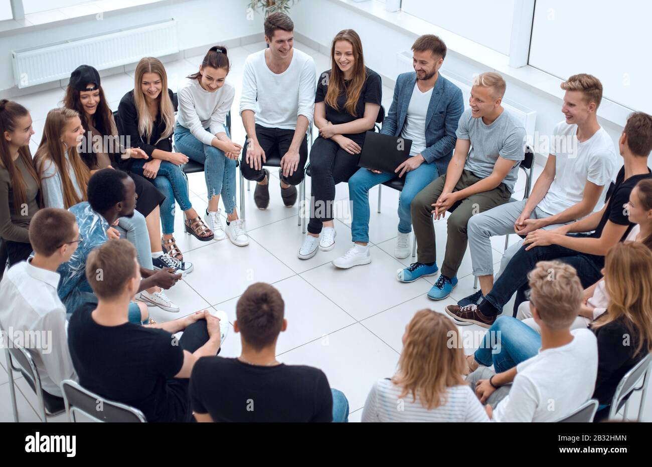 large group of diverse young people sitting in a circle Stock Photo - Alamy