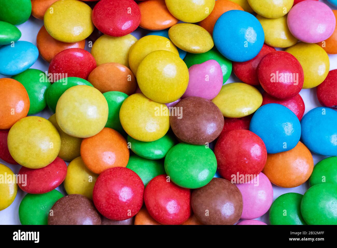 Pile of multicolored candies, background or texture Stock Photo - Alamy