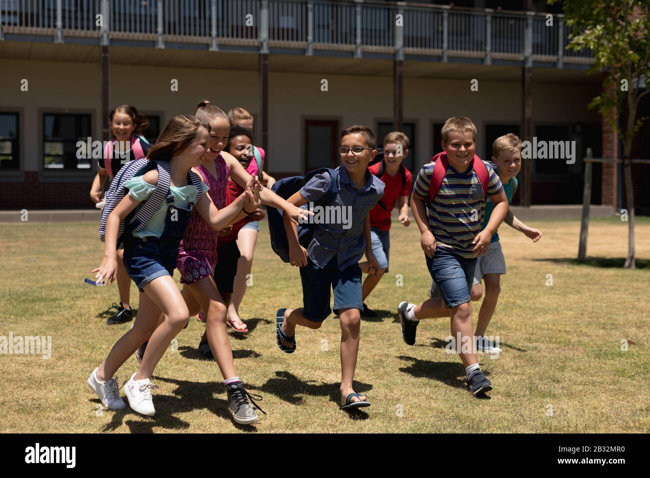 School children running in school playground Stock Photo - Alamy