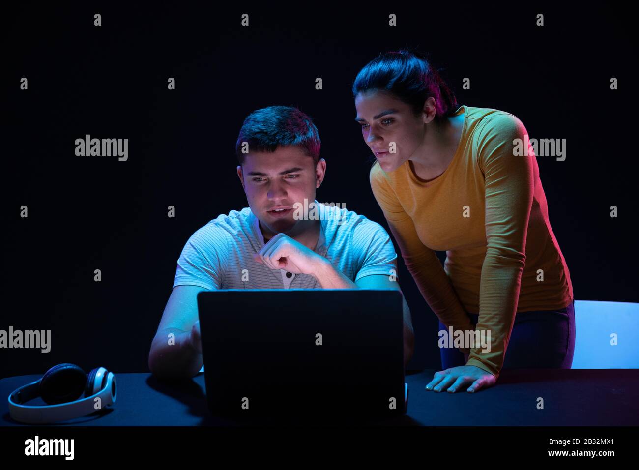 Black background working late hi-res stock photography and images - Alamy