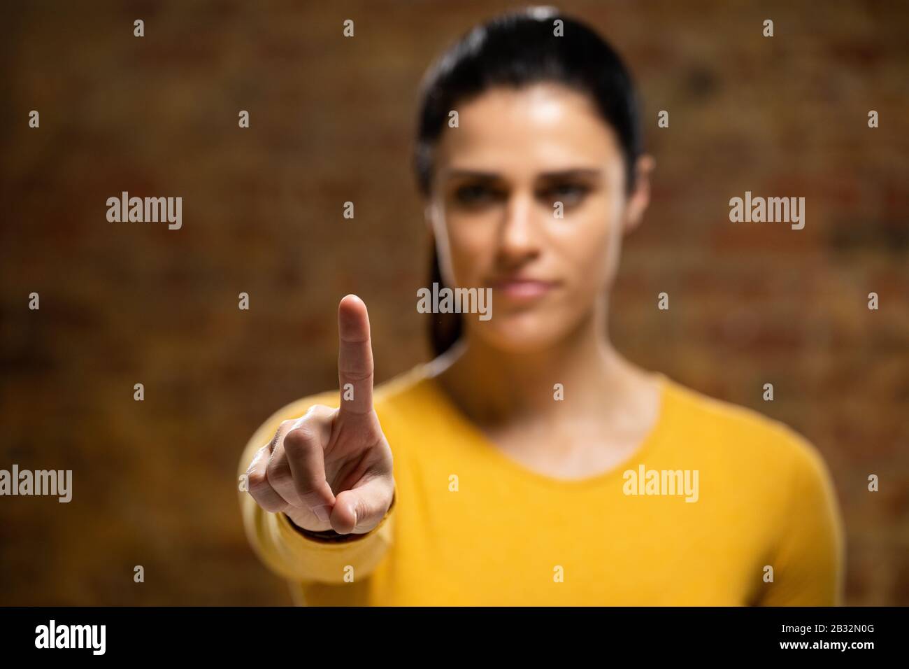 Hand raised index finger hi-res stock photography and images - Alamy