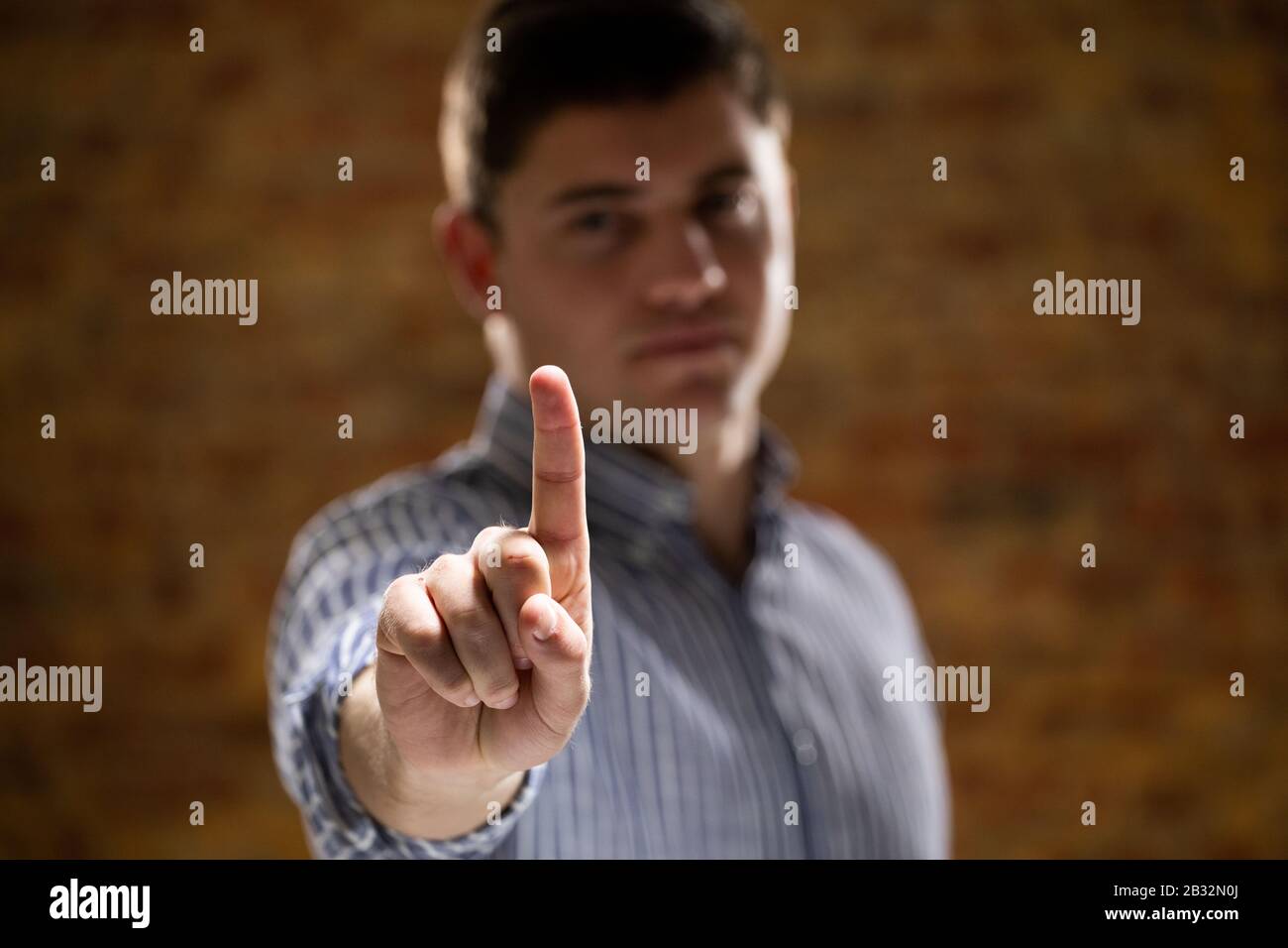 Hand raised index finger hi-res stock photography and images - Alamy