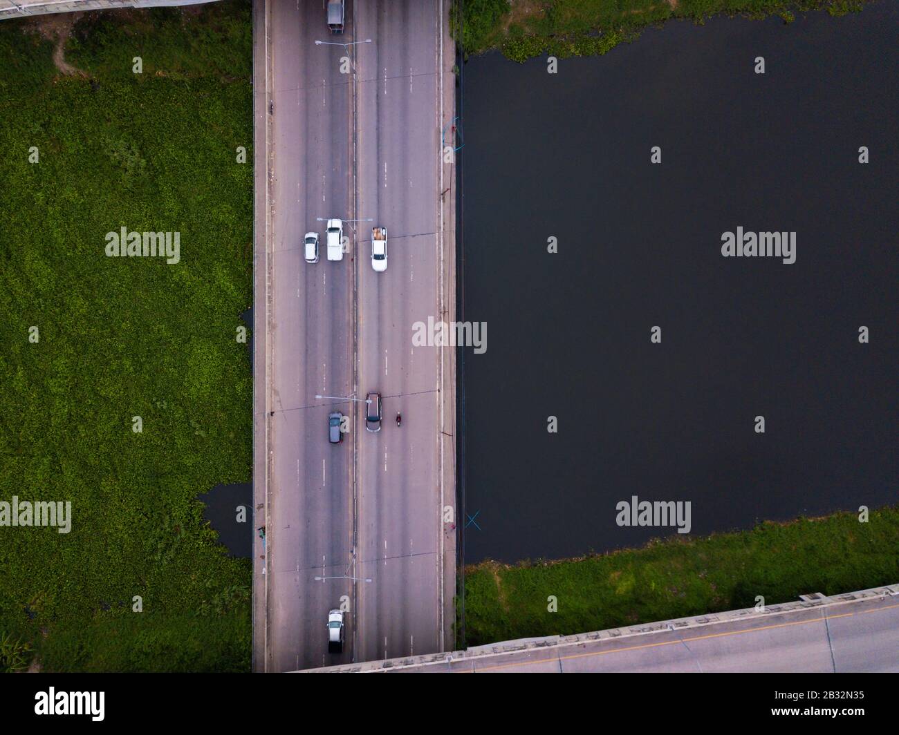 Aerial top view of bridge road over river automobile traffic of cars ...