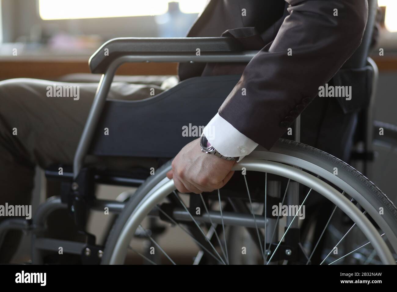 Guy in disabled carriage Stock Photo - Alamy