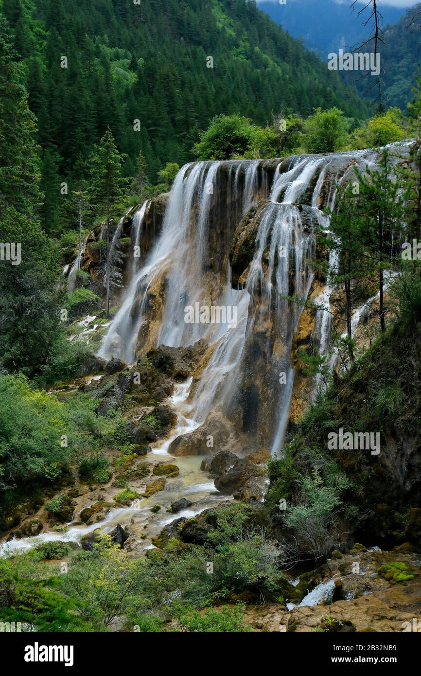 view of colorful lake and waterfall in jiuzhaigou national park ...