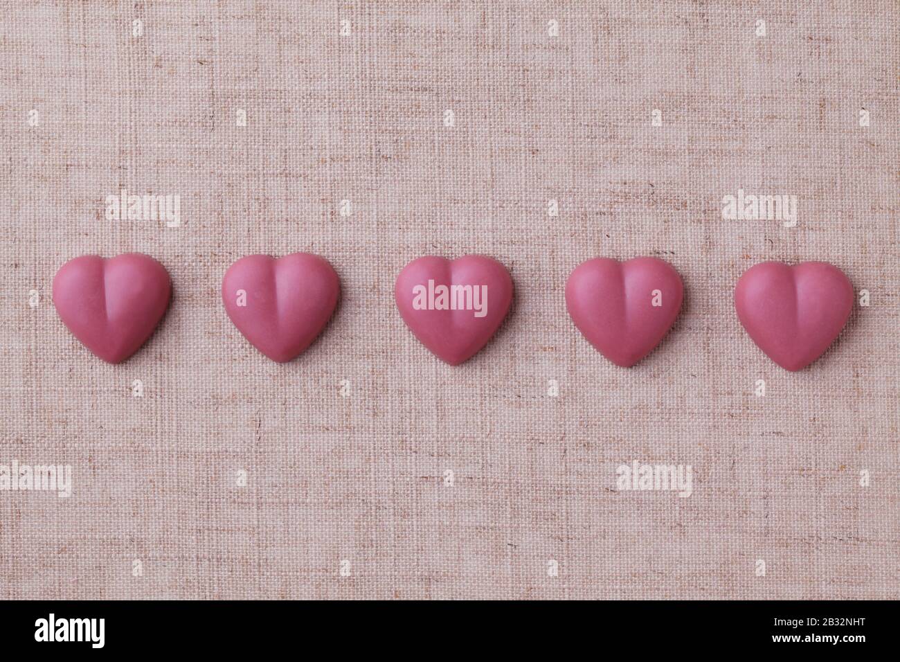 heart shaped pink ruby chocolate closeup isolated on white background ...