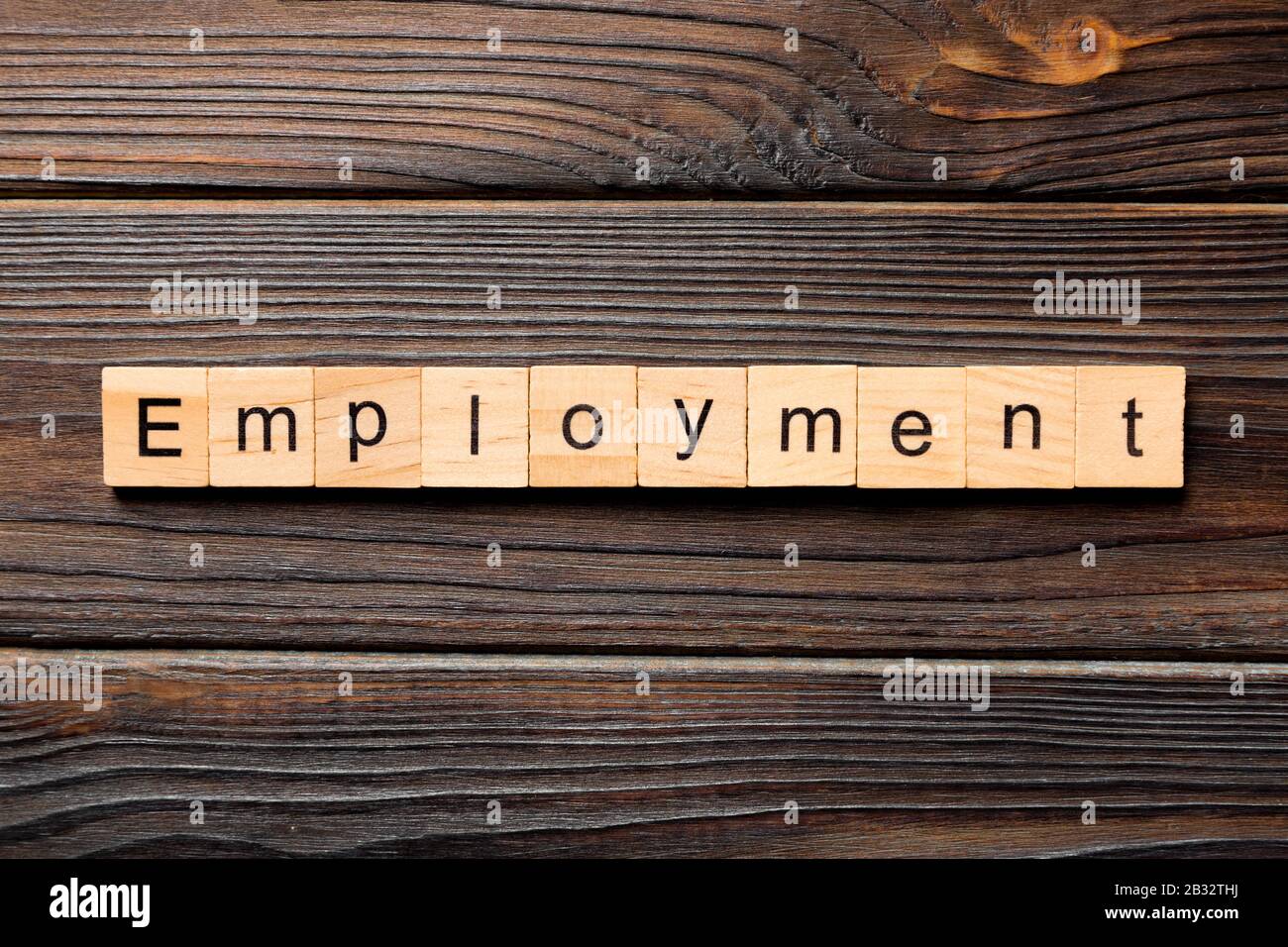 Employment word written on wood block. Employment text on wooden table ...