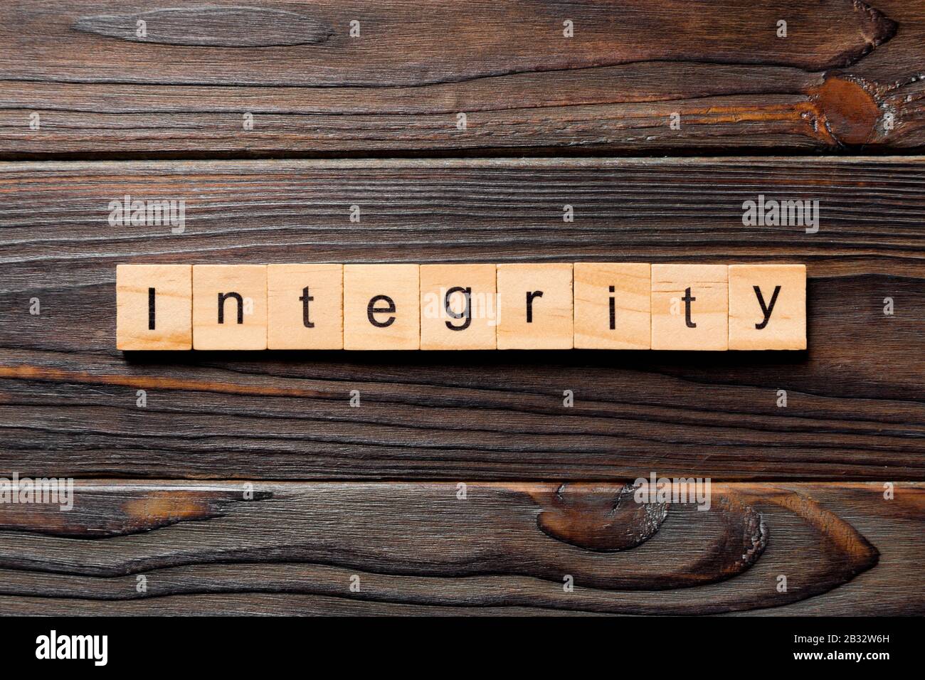 integrity word written on wood block. integrity text on table, concept ...