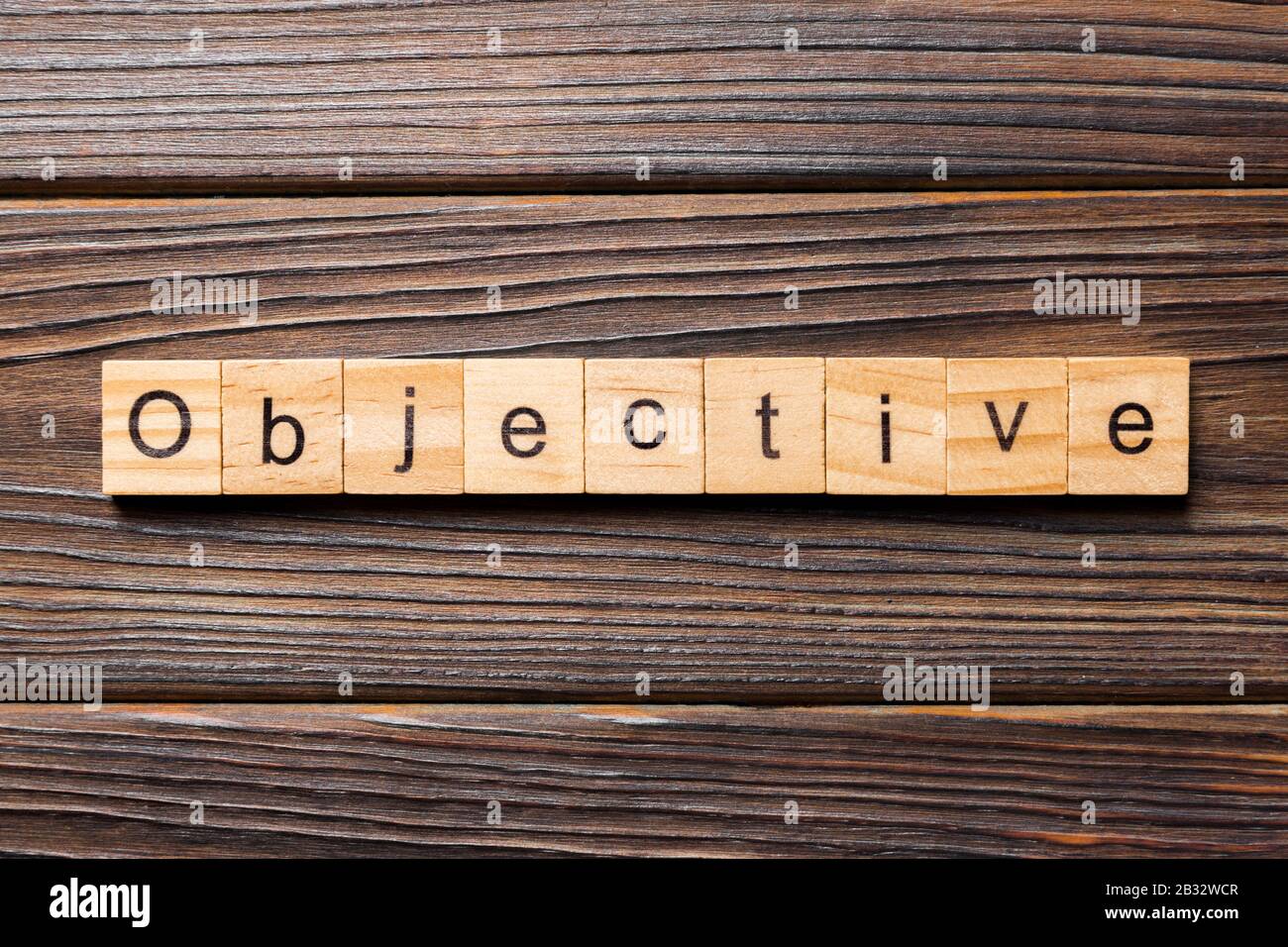 objective word written on wood block. objective text on table, concept ...