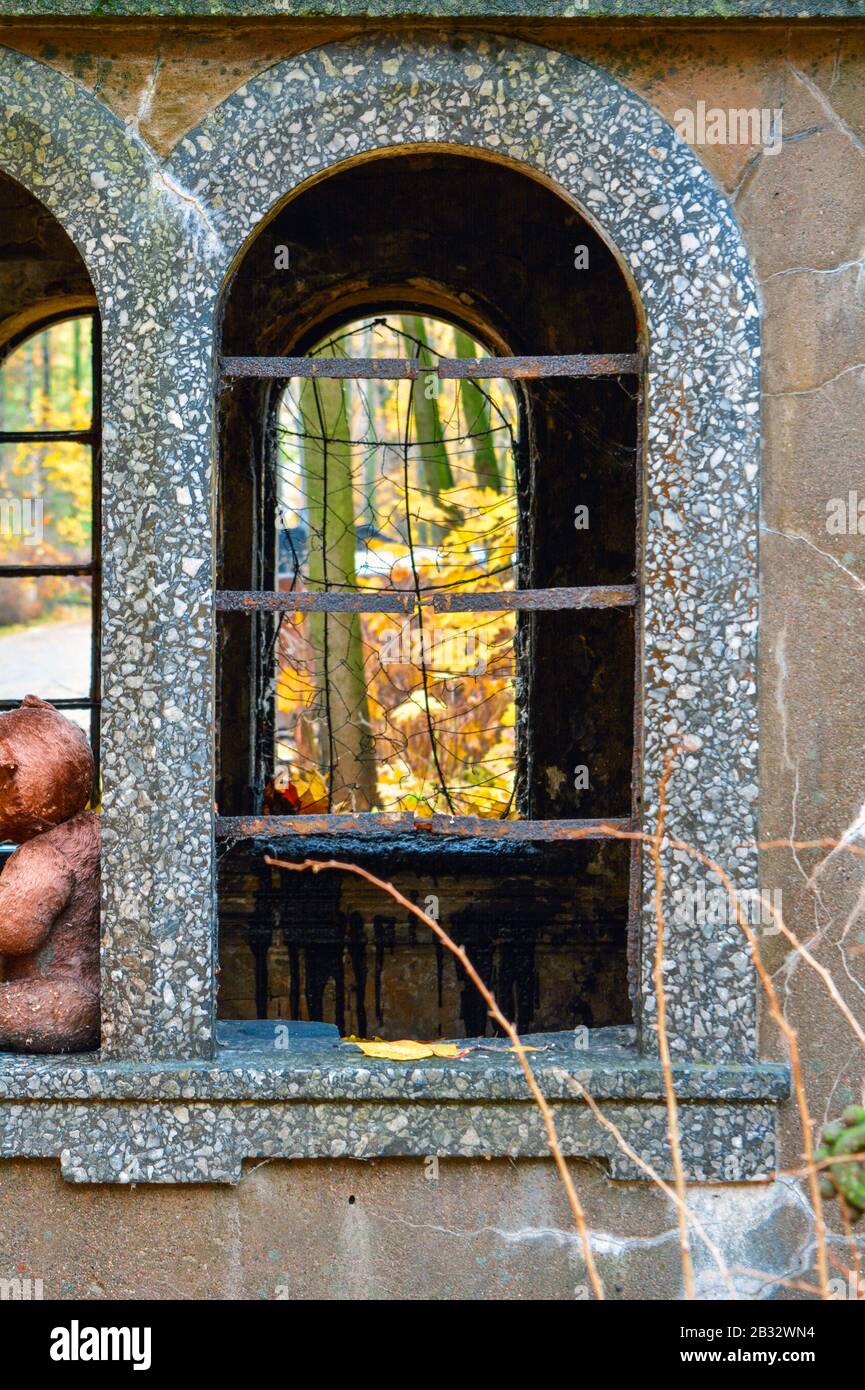 Window hole with lattice of old abandoned burial tomb crypt in public ...