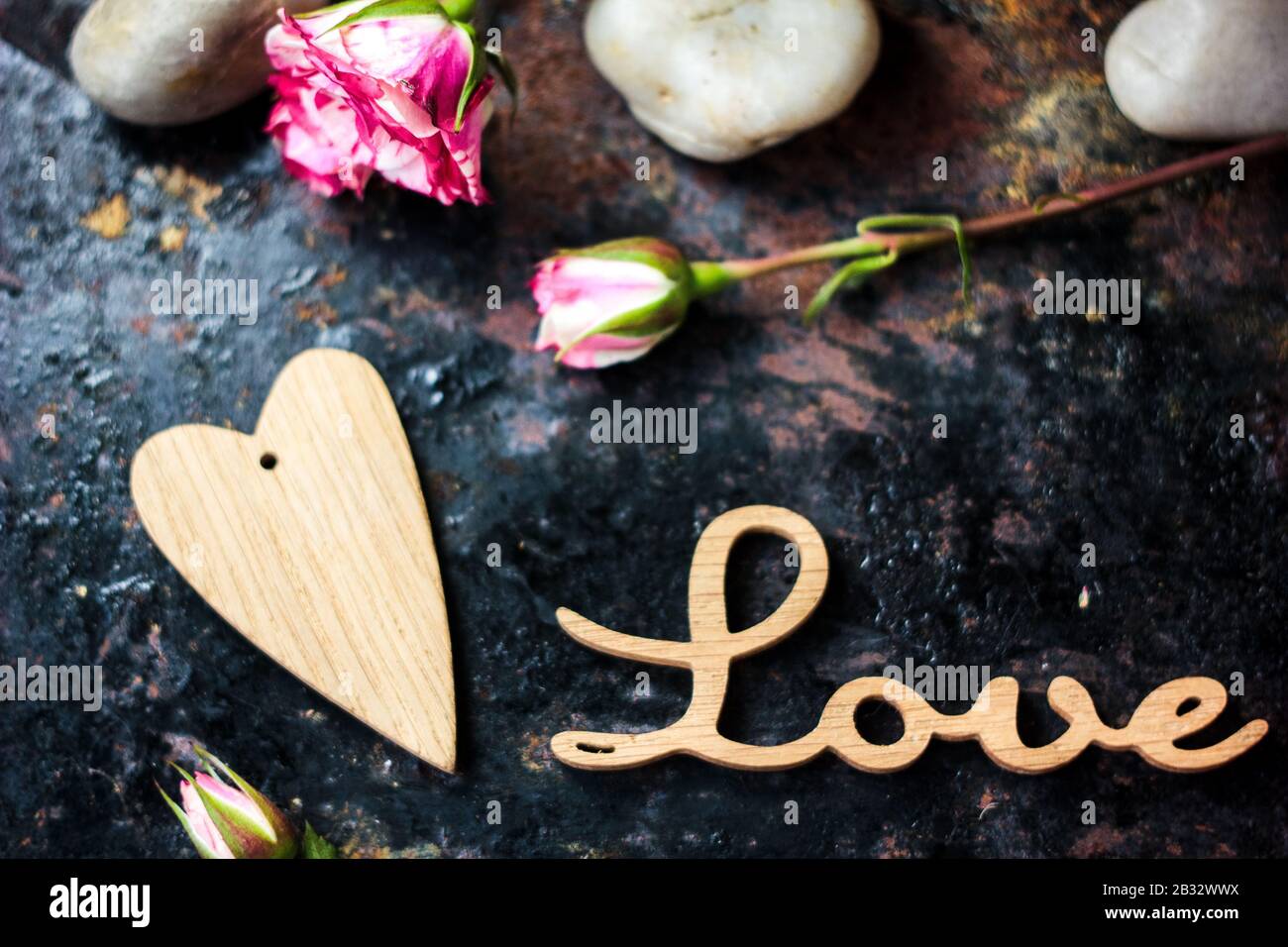Valentine's day background - rustic and black Stock Photo - Alamy