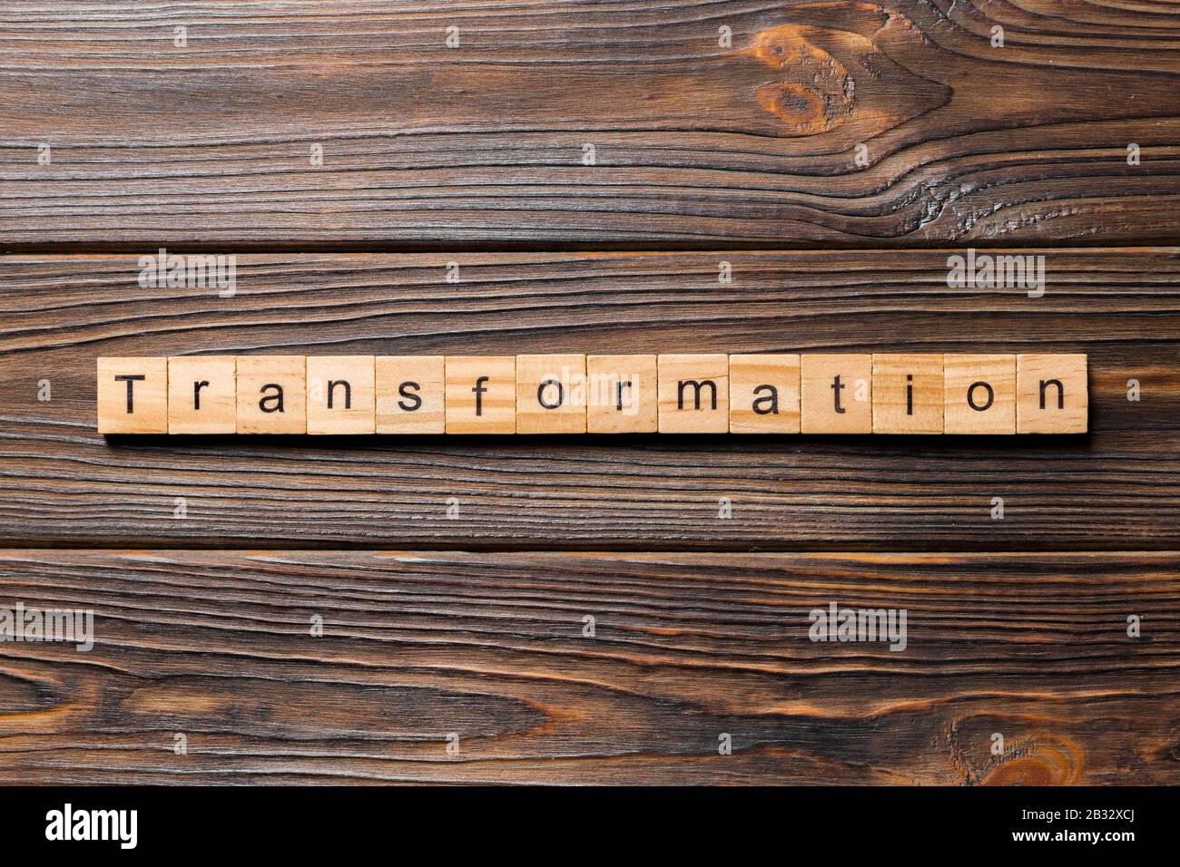 transformation word written on wood block. transformation text on table ...