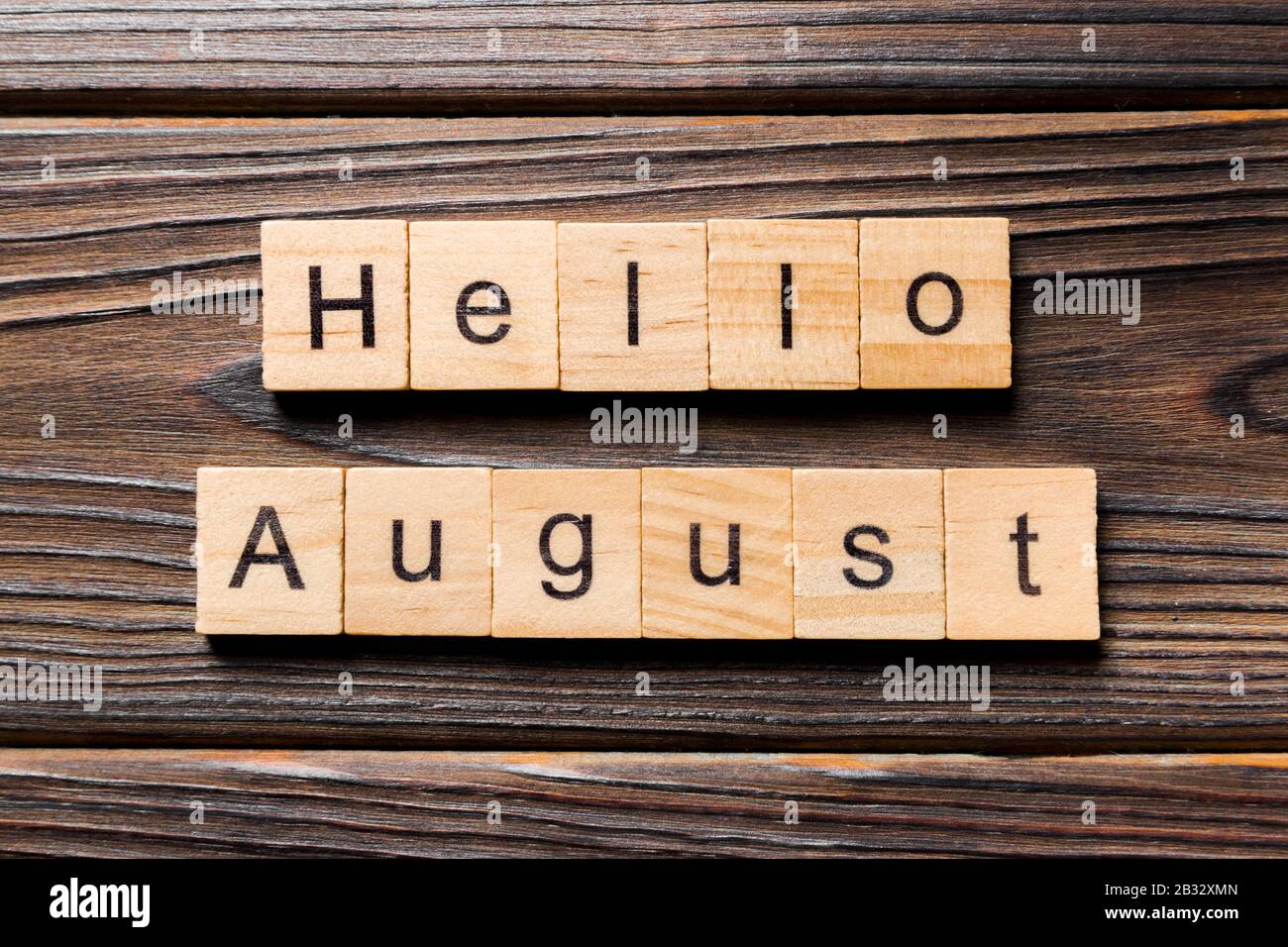 hello august word written on wood block. hello august text on table ...